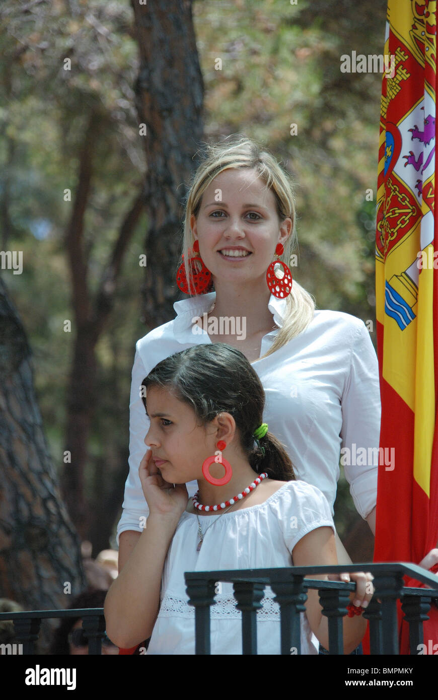 Spanish girls holding a flag, Romeria San Bernabe, Marbella, Costa del ...