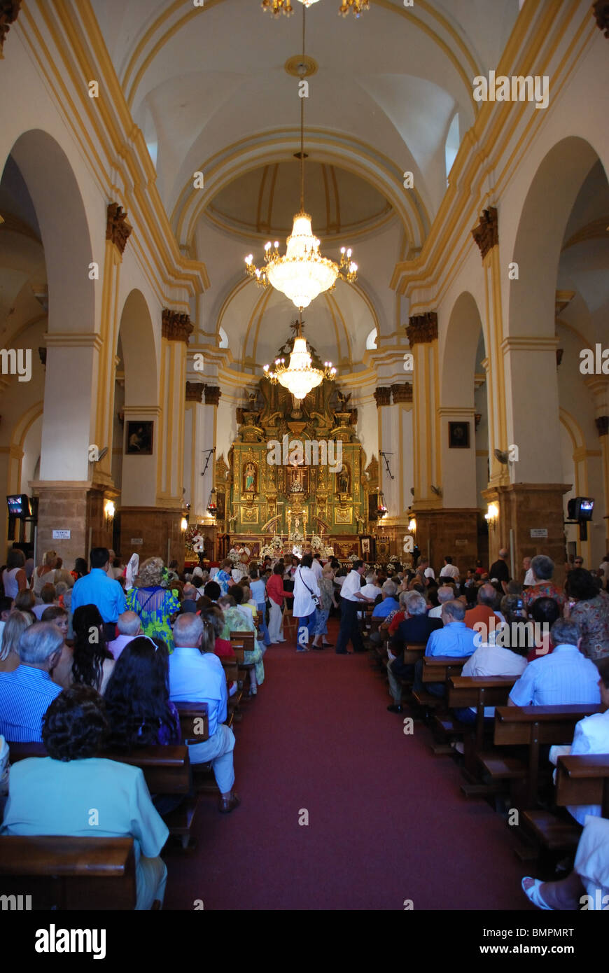 Congregation in the church (Iglesia de la Encarnacion), Marbella, Costa ...