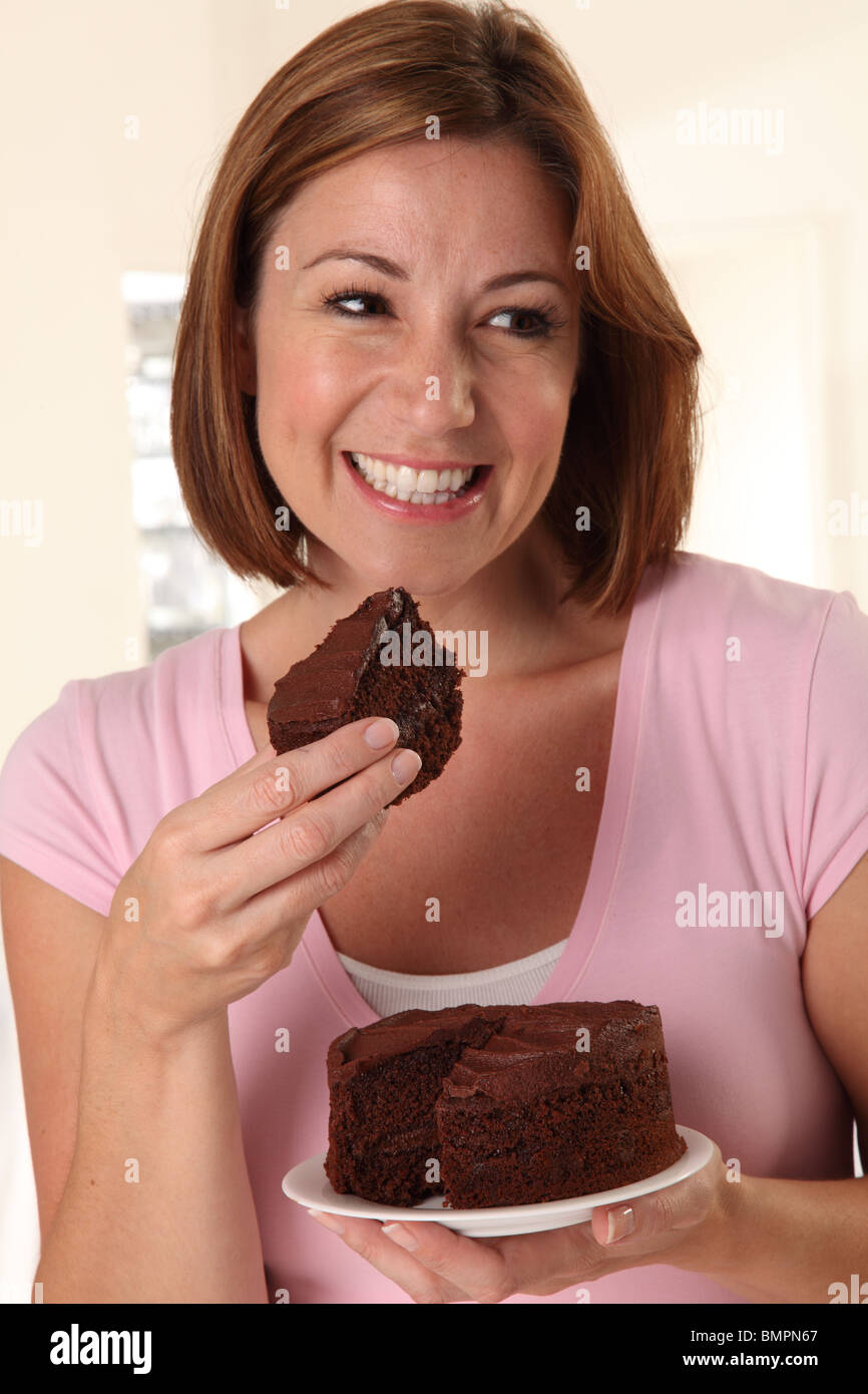 Fat woman eating slice cake hi-res stock photography and images - Alamy