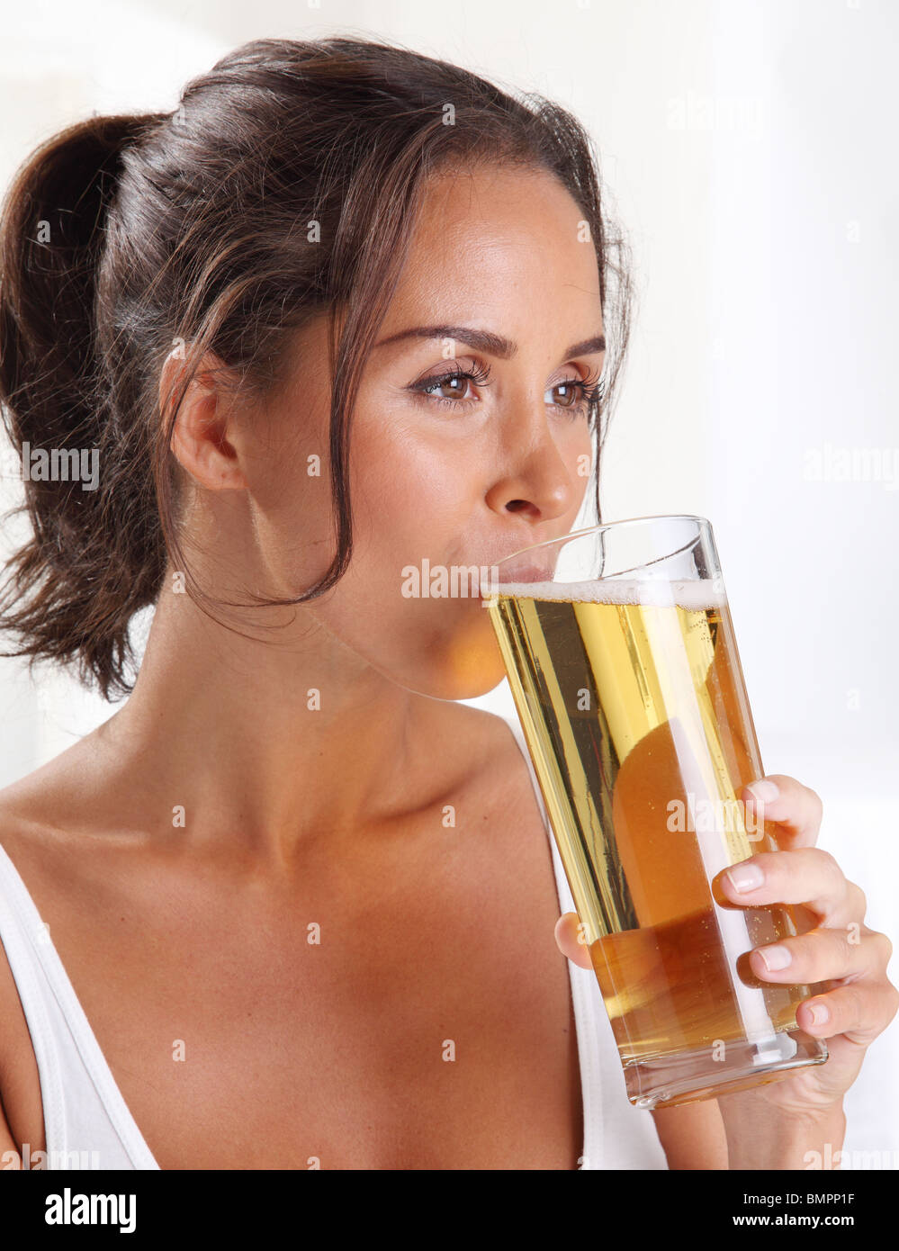 WOMAN DRINKING BEER Stock Photo - Alamy