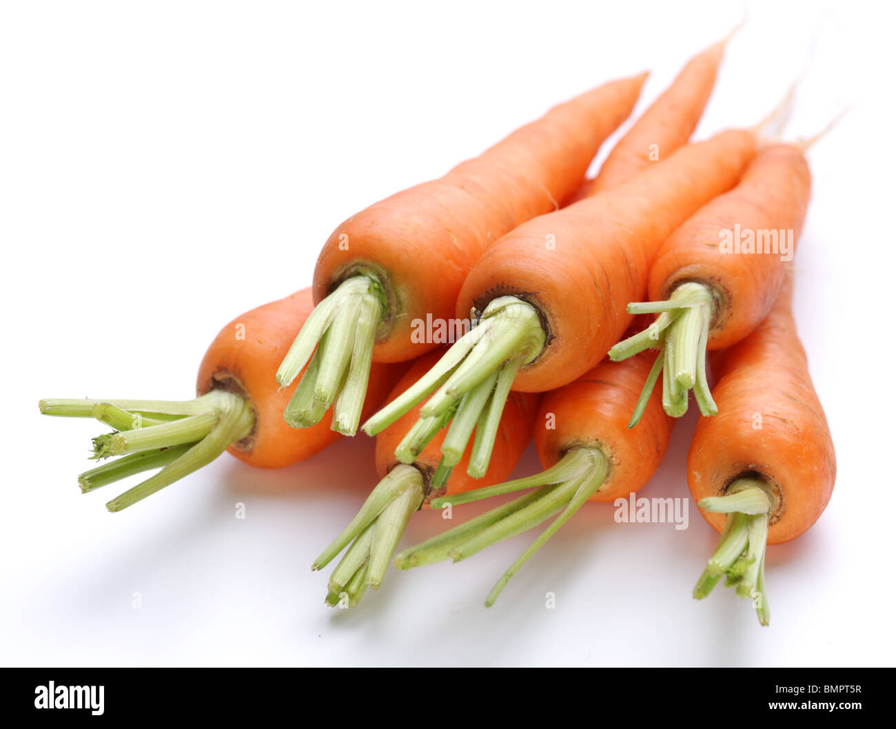 Ripe fresh carrots on a white background Stock Photo - Alamy