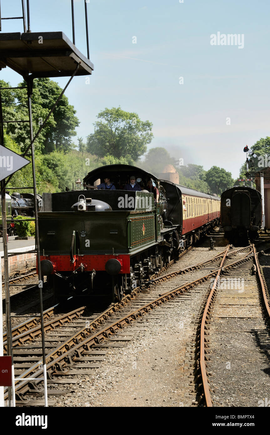 GWR 7800 Class 7812 Erlestoke Manor steam locomotive pulling coaches ...