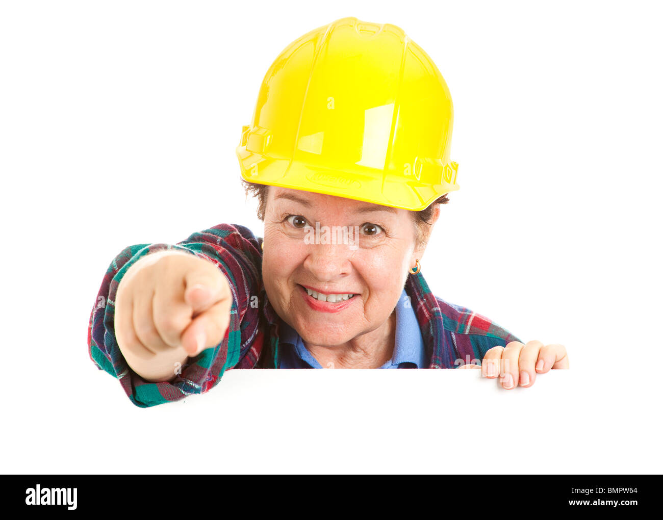Female construction worker pointing at you over blank white space ...