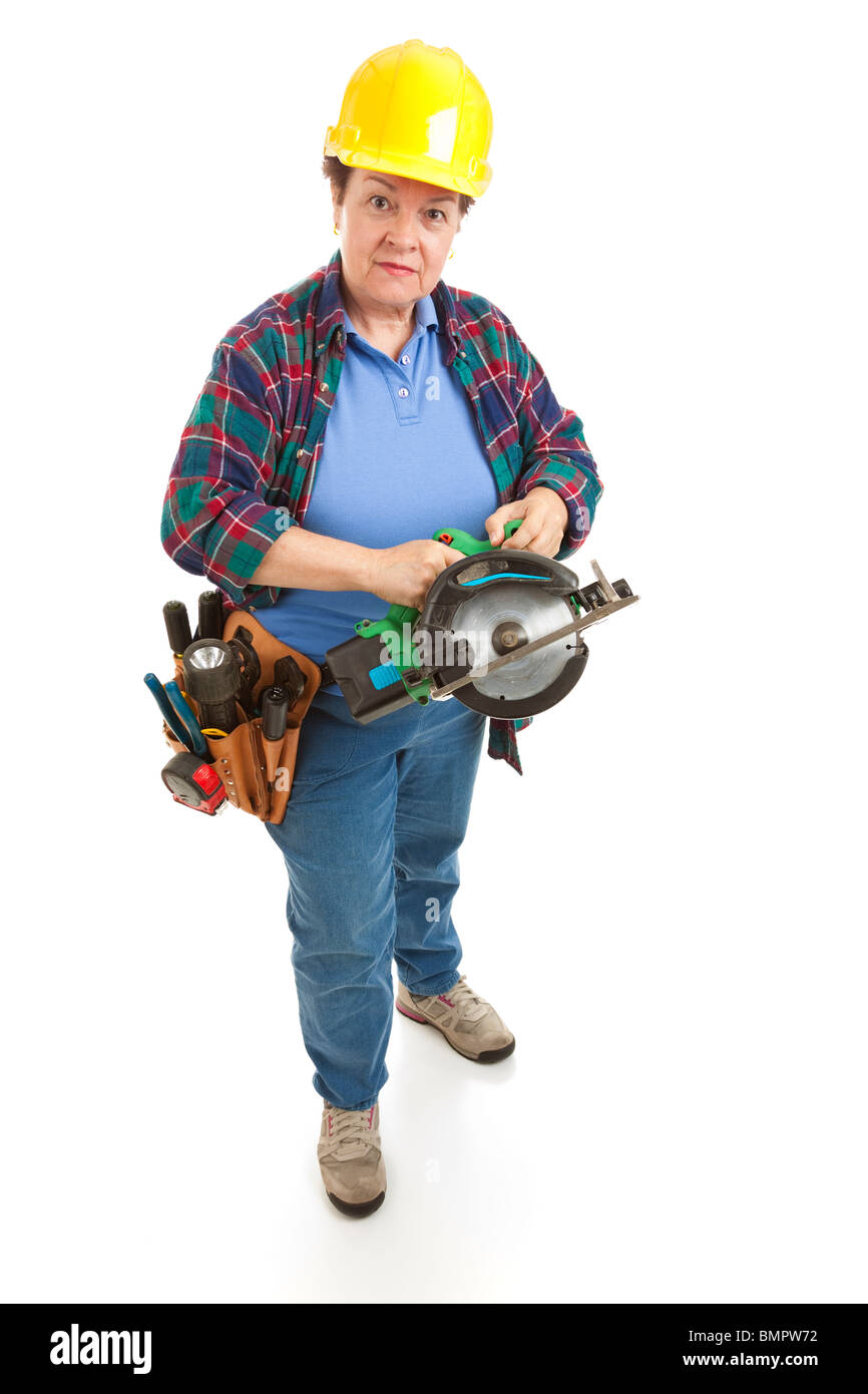 Female construction worker holding a circular power saw. Full body ...