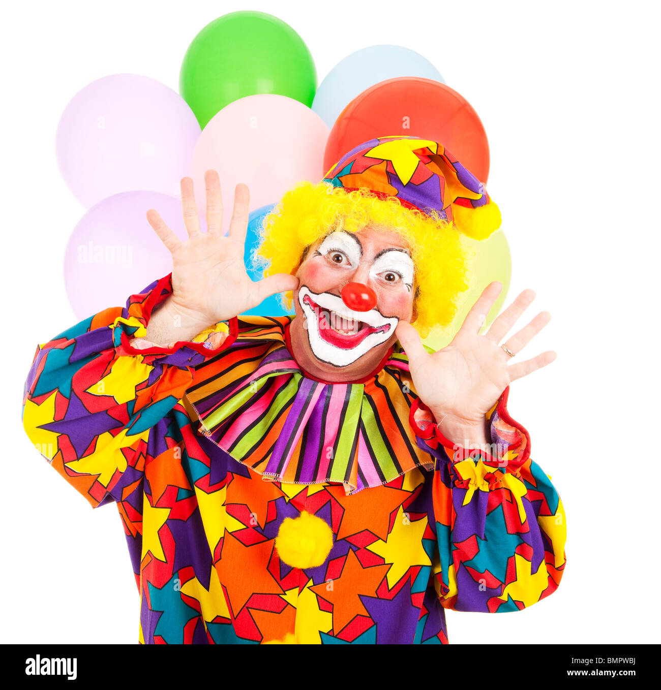 Funny birthday clown with balloons over white background Stock Photo ...