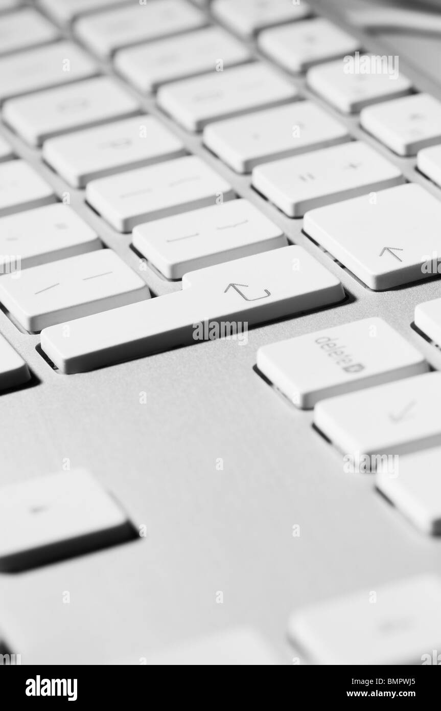 Close up of a crop section of a white computer keyboard. The focus is ...