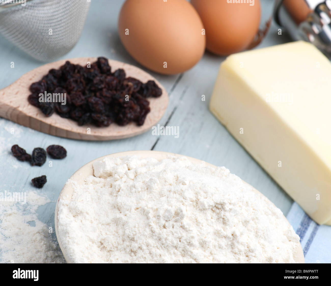 Baking Ingredients Laid Out On A Wooden Kitchen Table Stock Photo - Alamy