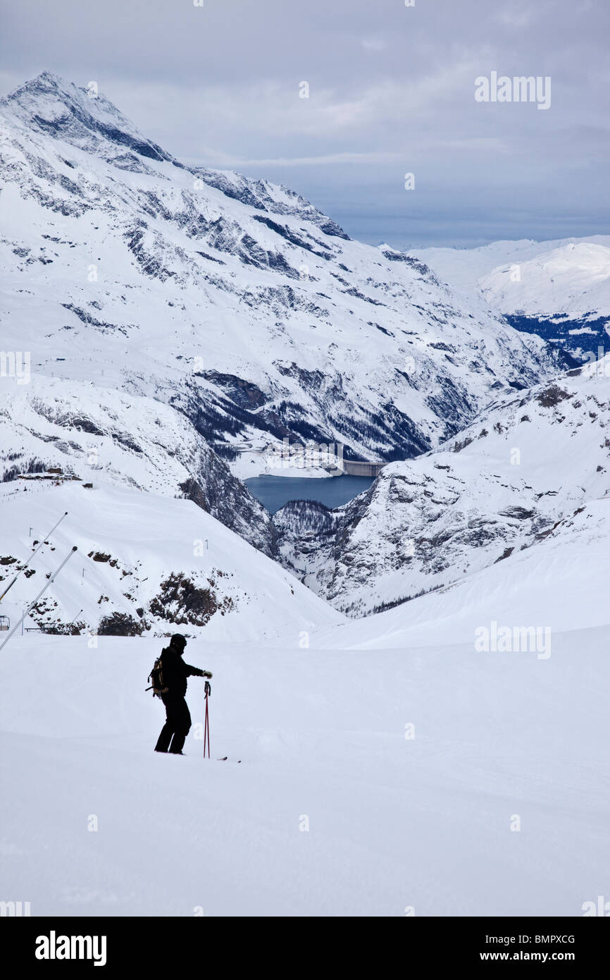 A single skier preparing at the top of a slope the French ski resort of ...