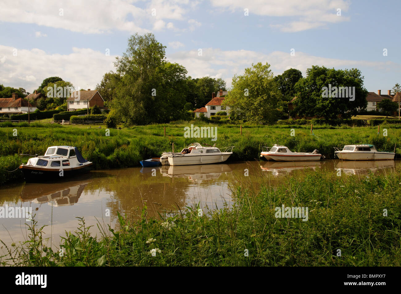 Boats alongside on the River Rother at Newenden Cranbrook Kent England ...