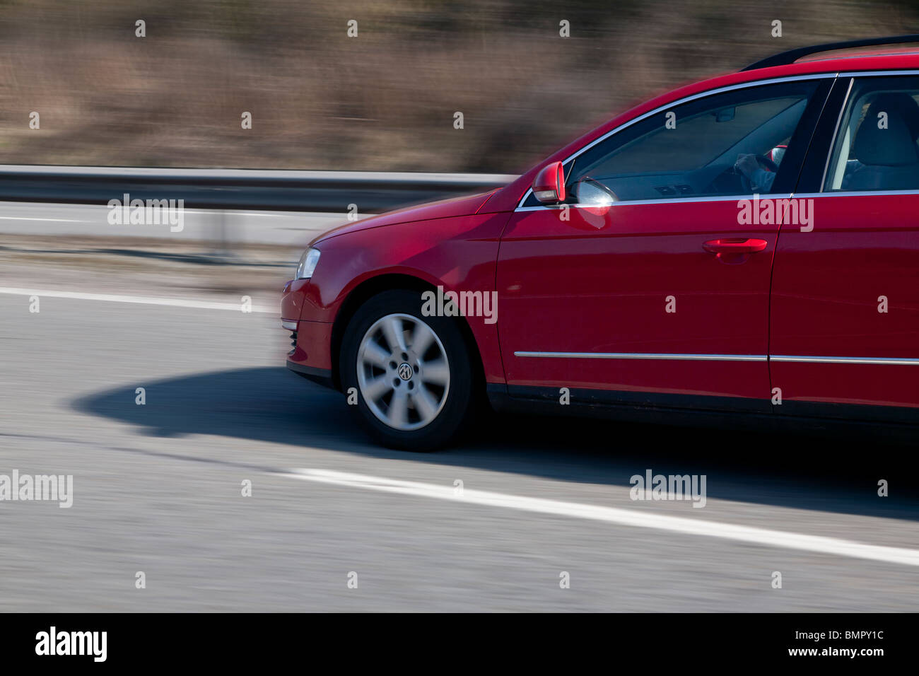RED CAR AT TRAVELLING SPEED ON MOTORWAY Stock Photo - Alamy