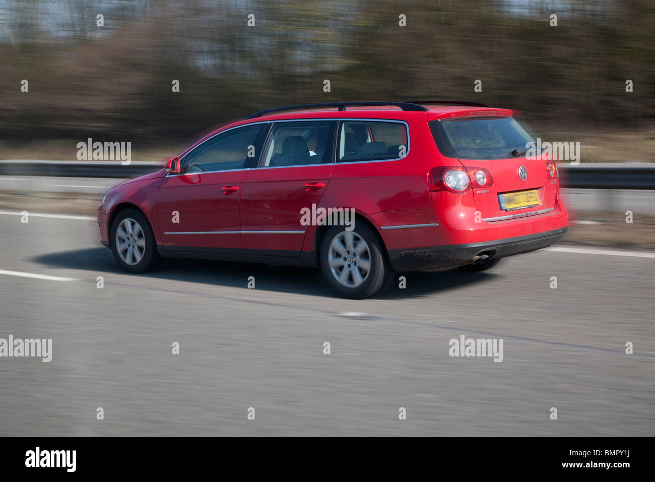 RED CAR TRAVELLING AT SPEED ON MOTORWAY UK Stock Photo - Alamy
