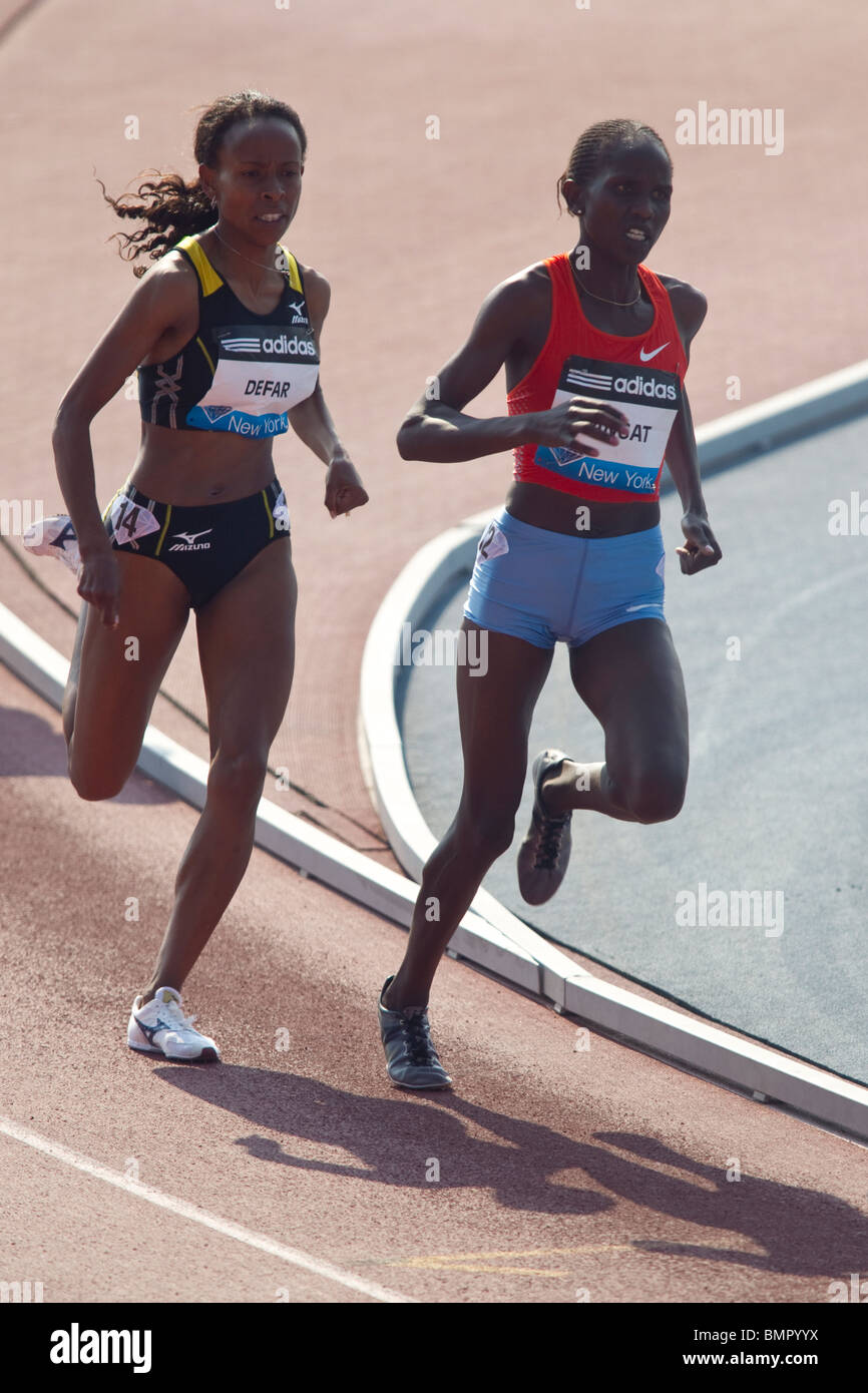 Nancy Jebet Langat (KEN) and Meseret Defar(ETH) lead the competitors in the Women's 1500 meters ...