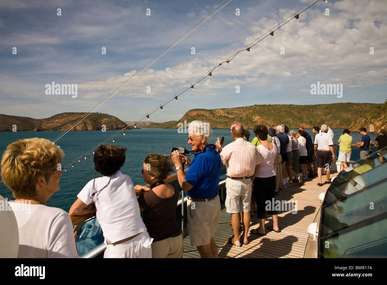Orion passengers gather on an observation deck as the Australian ...
