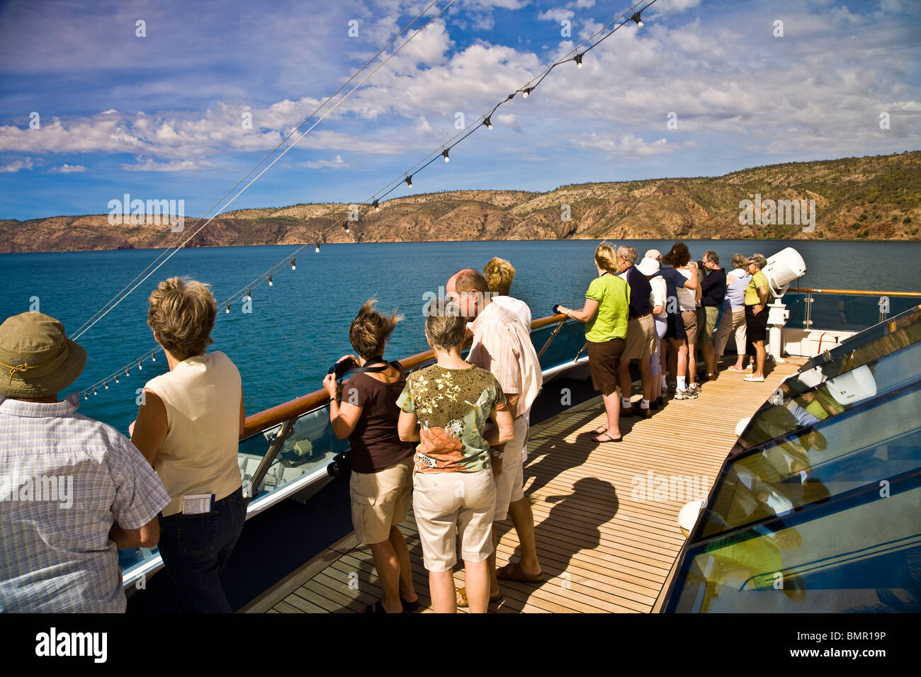 Orion passengers gather on an observation deck as the Australian ...