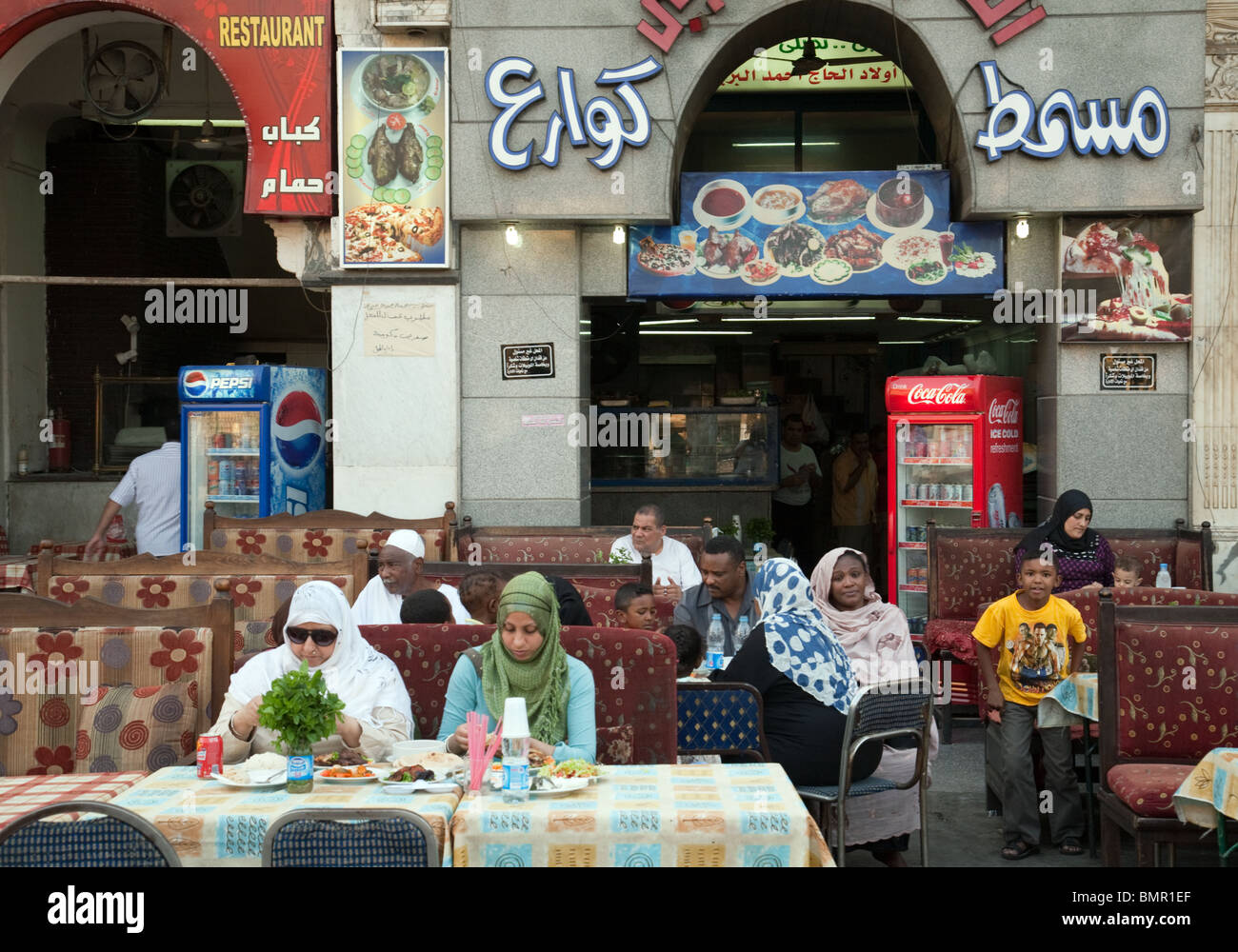 People congregating in the restaurants and cafes of the Islamic quarter ...