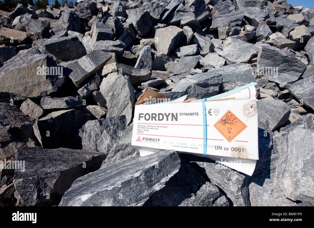Empty dynamite box on exploded rocks . Bedrock is exploded to smaller ...