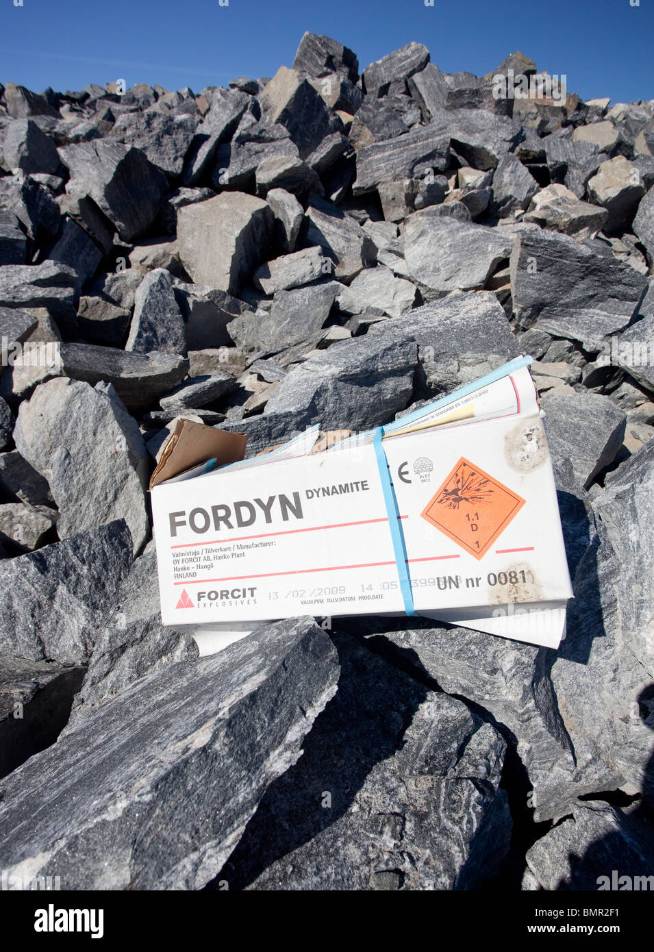 Empty dynamite box on exploded rocks . Bedrock is exploded to smaller ...