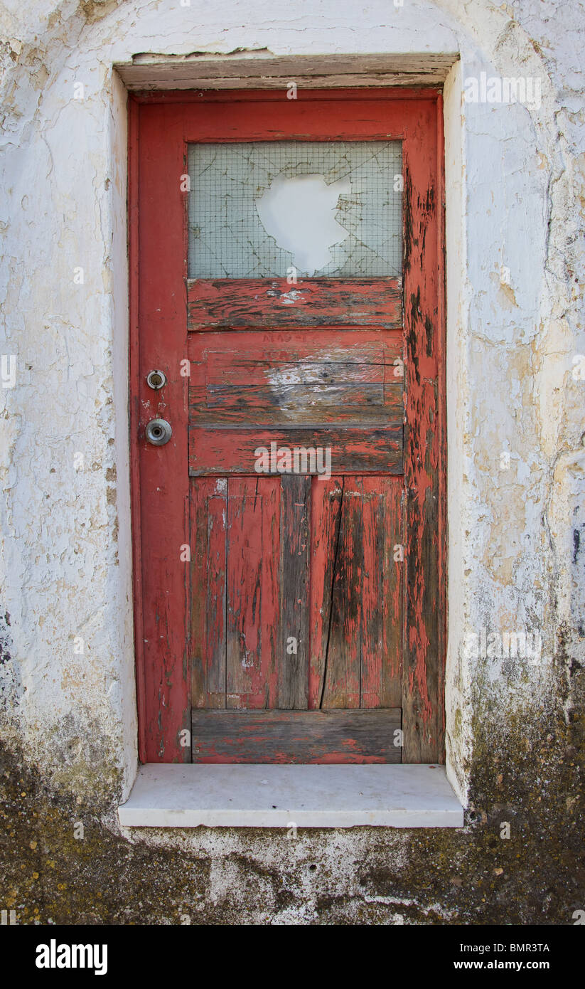 Rustic Faded Red Door Stock Photo - Alamy