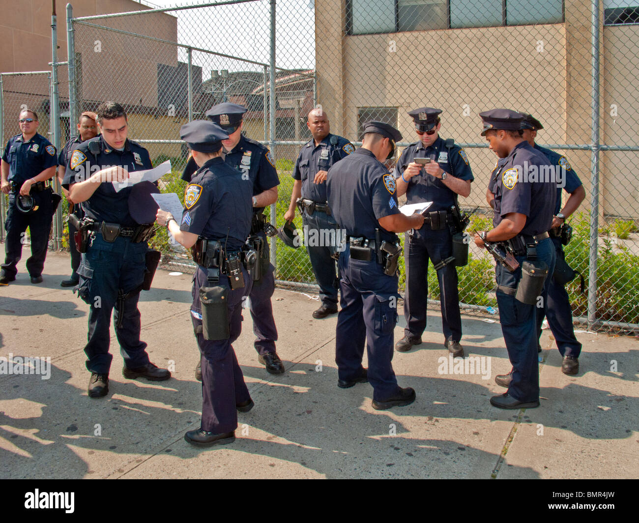 Police officers receive assignments at the beginning of their shift in ...