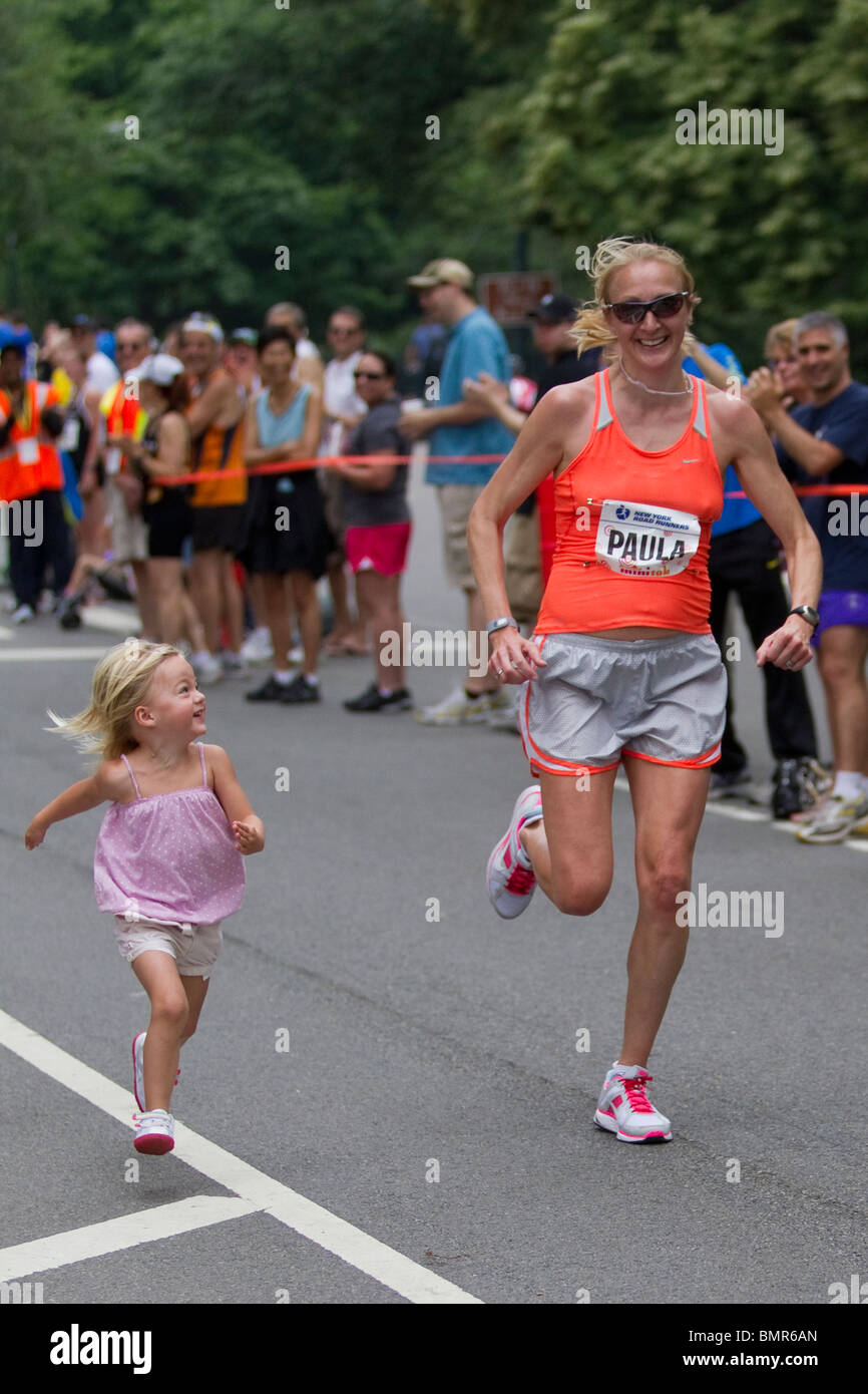 A pregnant Paula Radcliffe (GBR) running alongside her daughter, Isla ...
