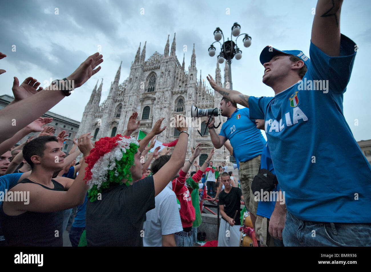 Italian football fans wearing Italy's colours cheer for Italy in Piazza ...