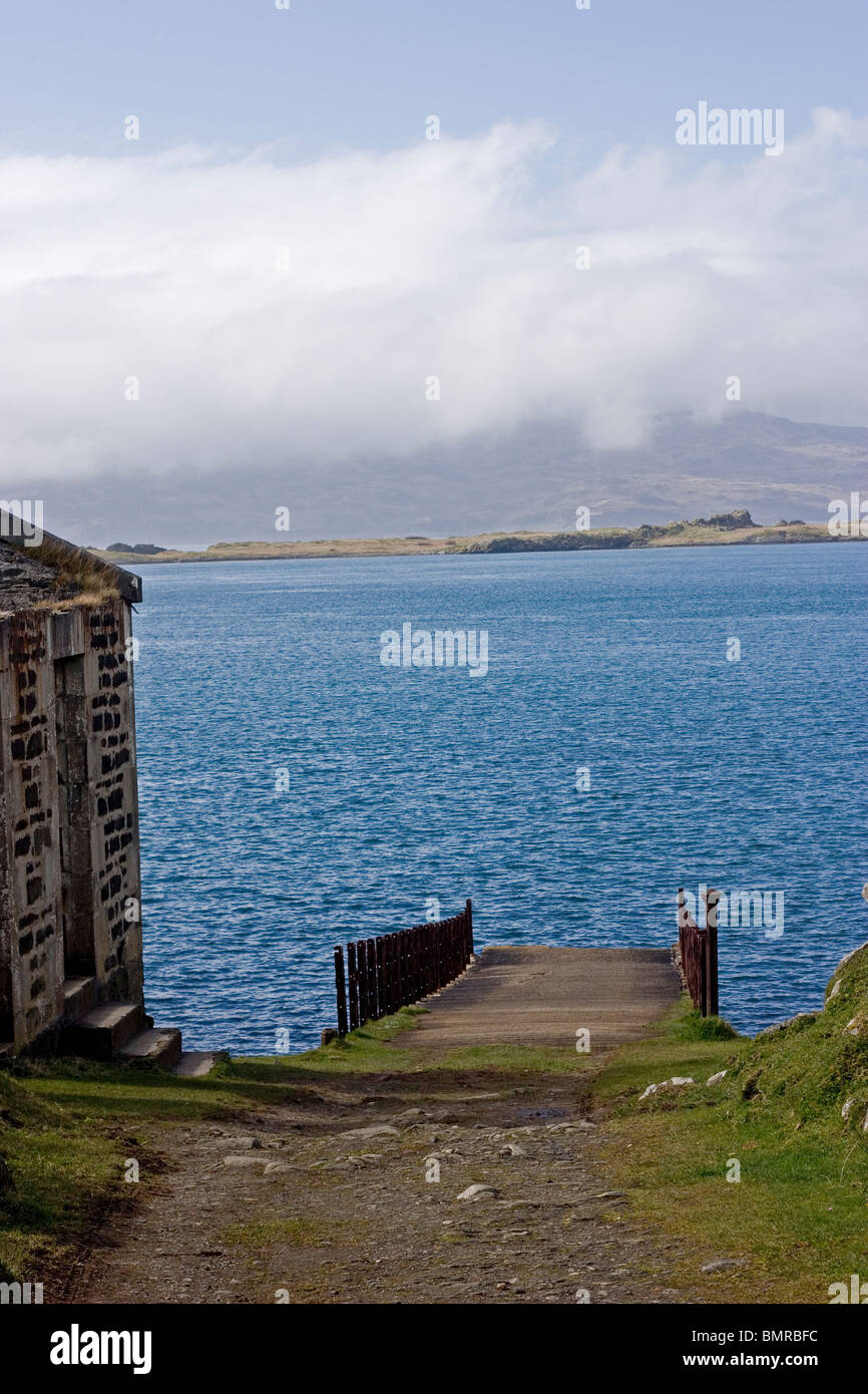 The old pier and building at Aird on the Craignish Peninsula Argyll ...