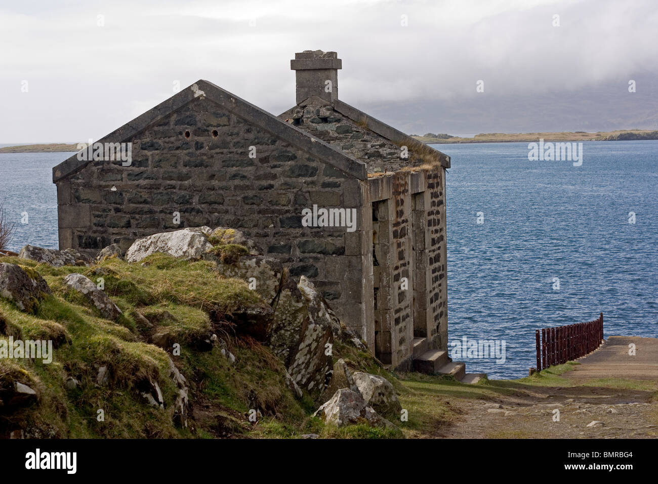 The old pier and building at Aird on the Craignish Peninsula Argyll ...
