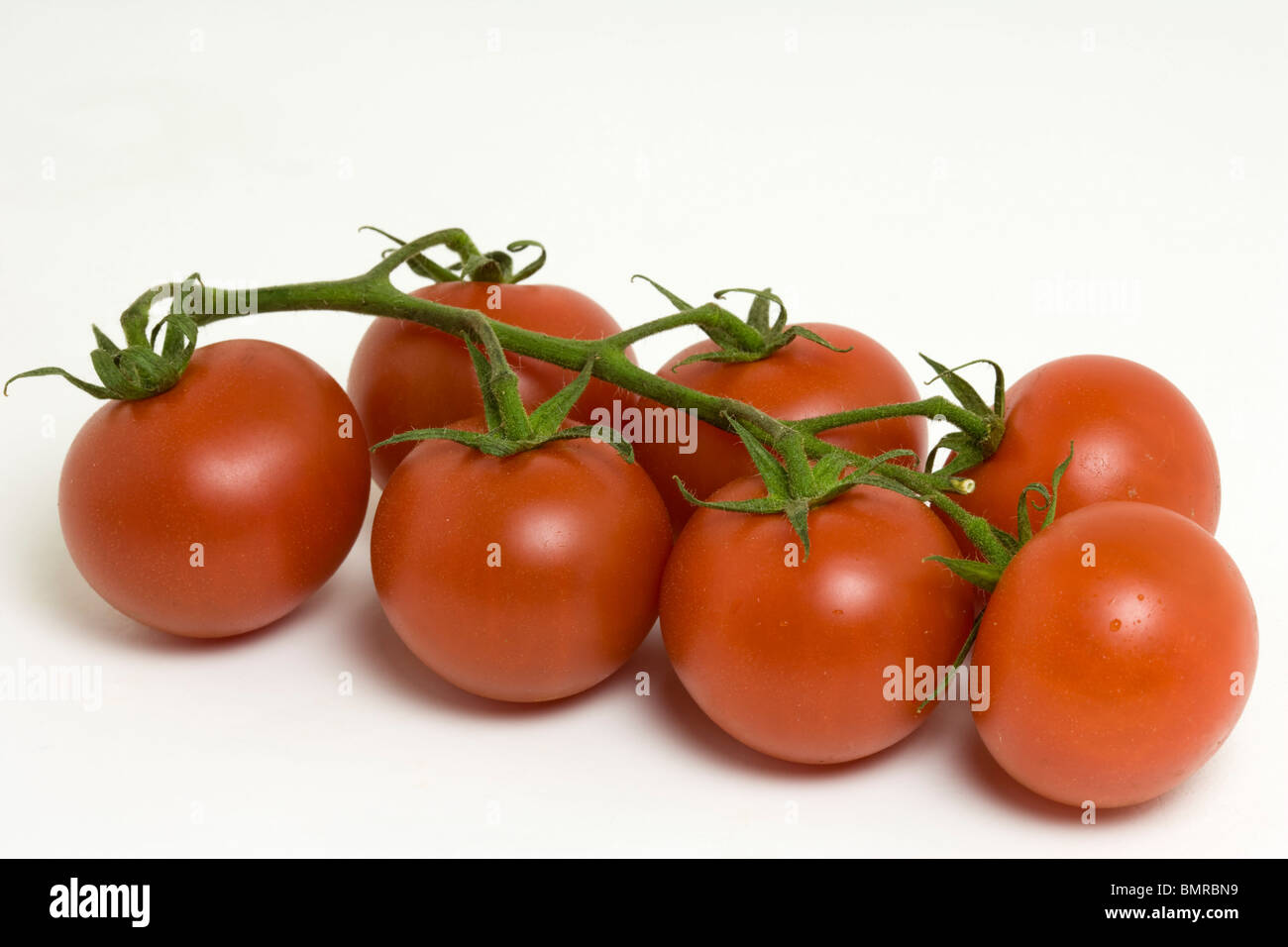 Red vine tomatoes Stock Photo - Alamy