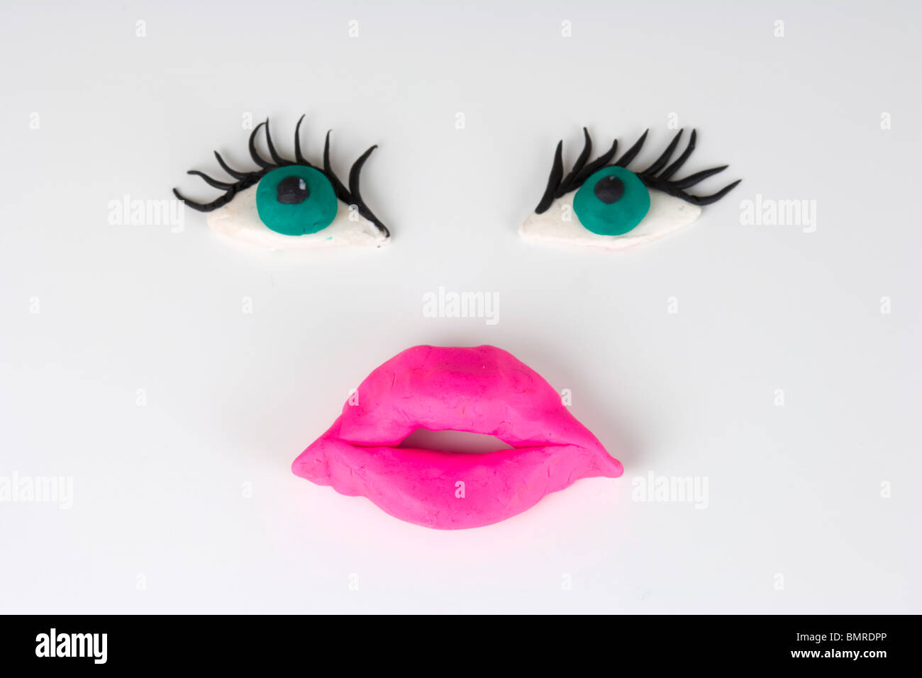 Plasticine figurines, Female face, eyes and lips Stock Photo - Alamy