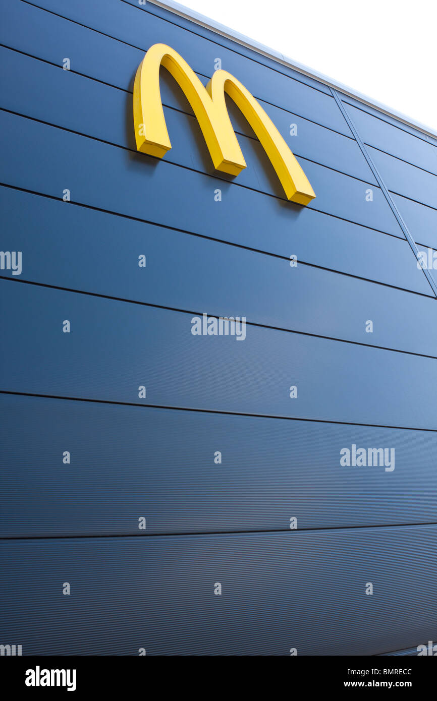 Macdonalds yellow m golden arches on side of restuarant Stock Photo - Alamy