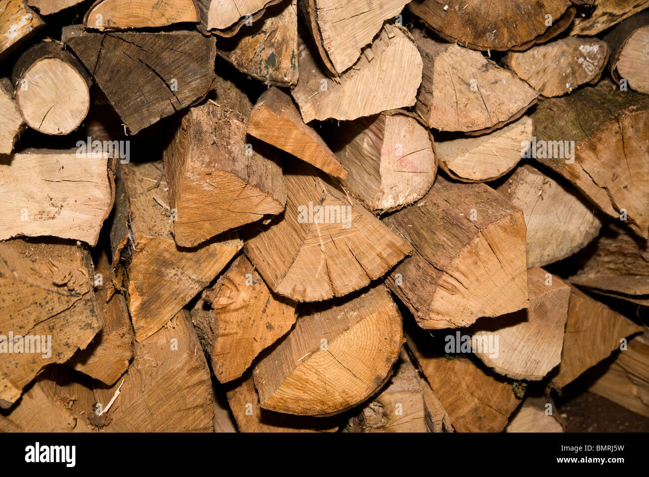 Logs Stacked Ready for Burning Stock Photo - Alamy