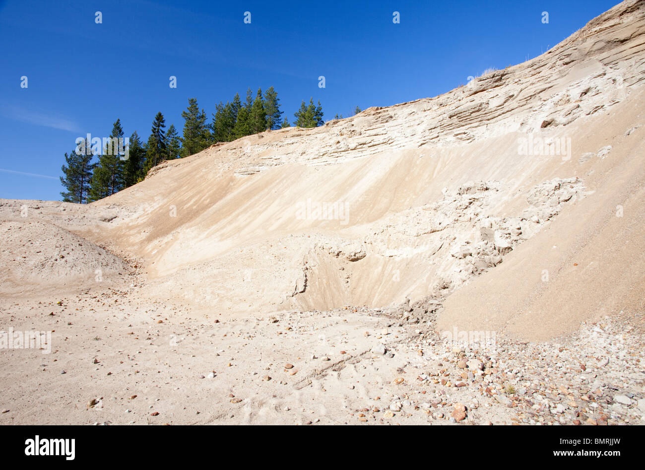 Erosion on a sand quarrying sandpit wall at a sandy ridge , Finland ...