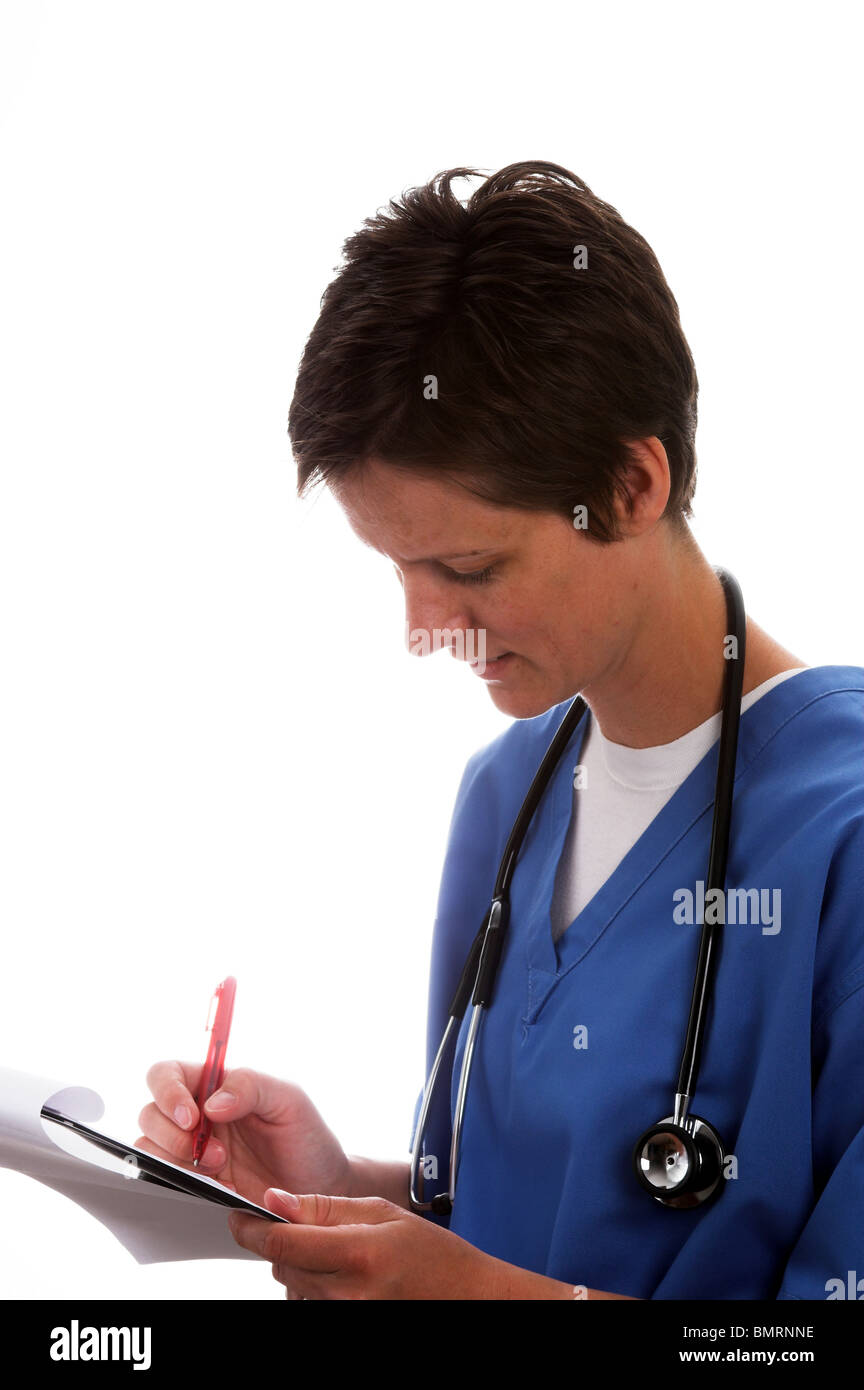 Nurse writing in medical notes Stock Photo - Alamy