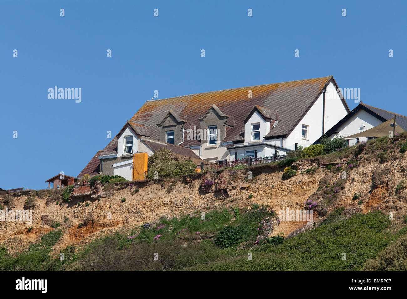 Coastal erosion cliff house High Resolution Stock Photography and ...