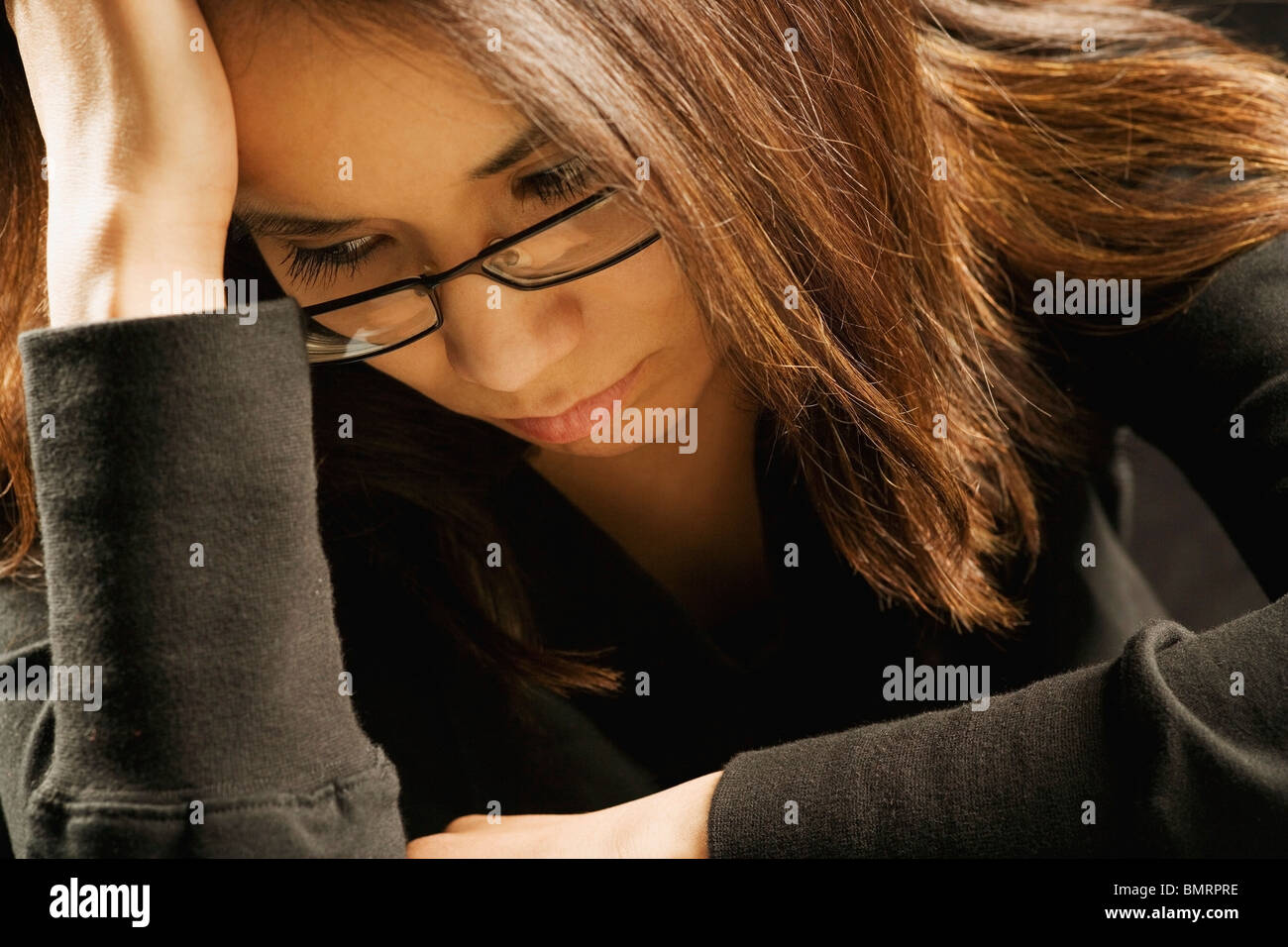 A Young Woman Looking Sad Stock Photo - Alamy