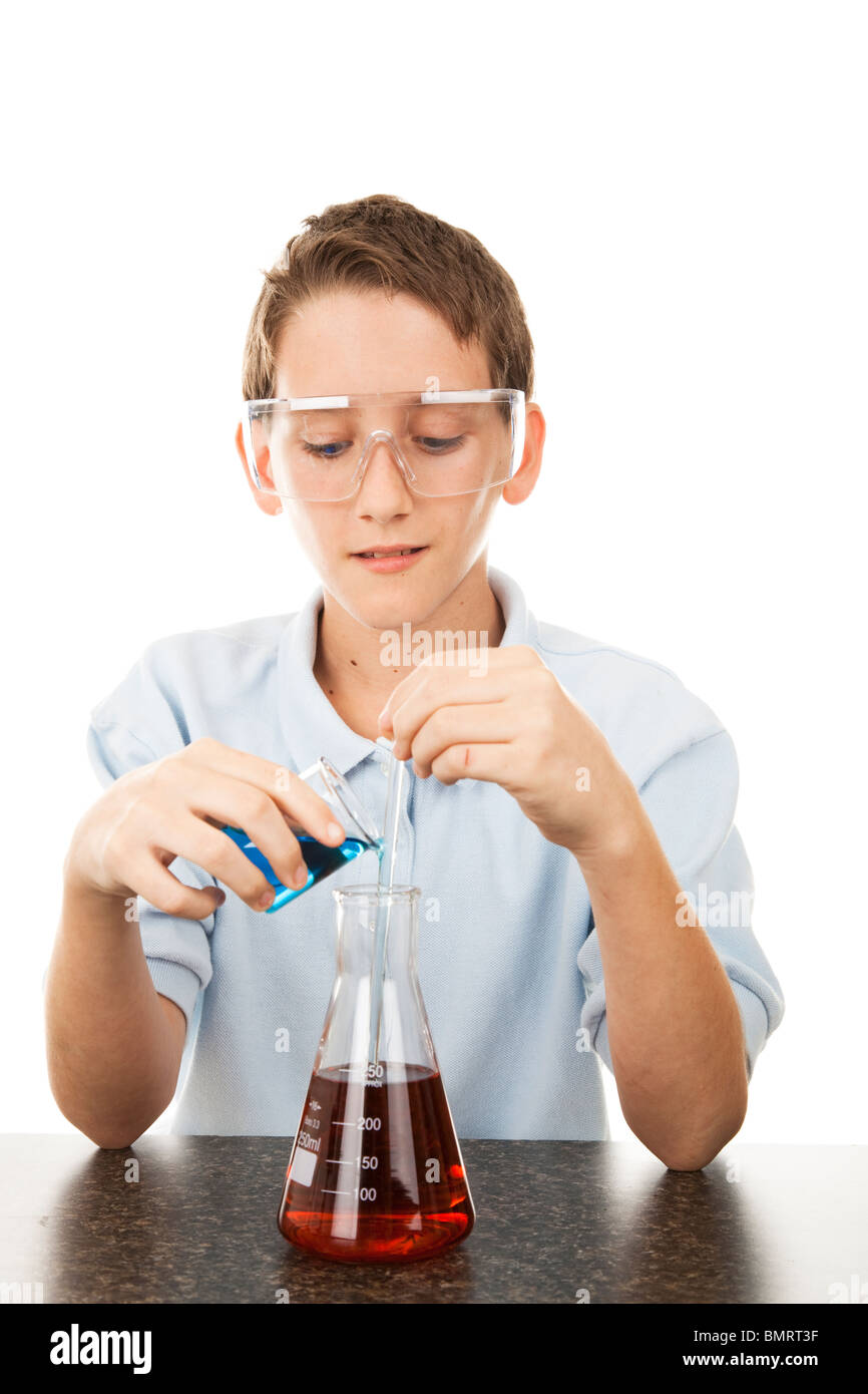Little boy learning science, mixing chemicals in the school laboratory ...