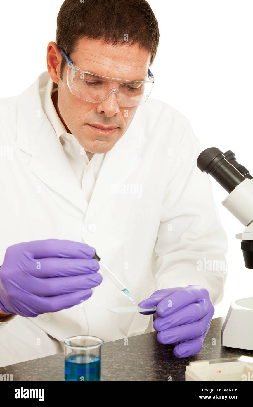 Scientist testing a chemical compound in his laboratory. White ...