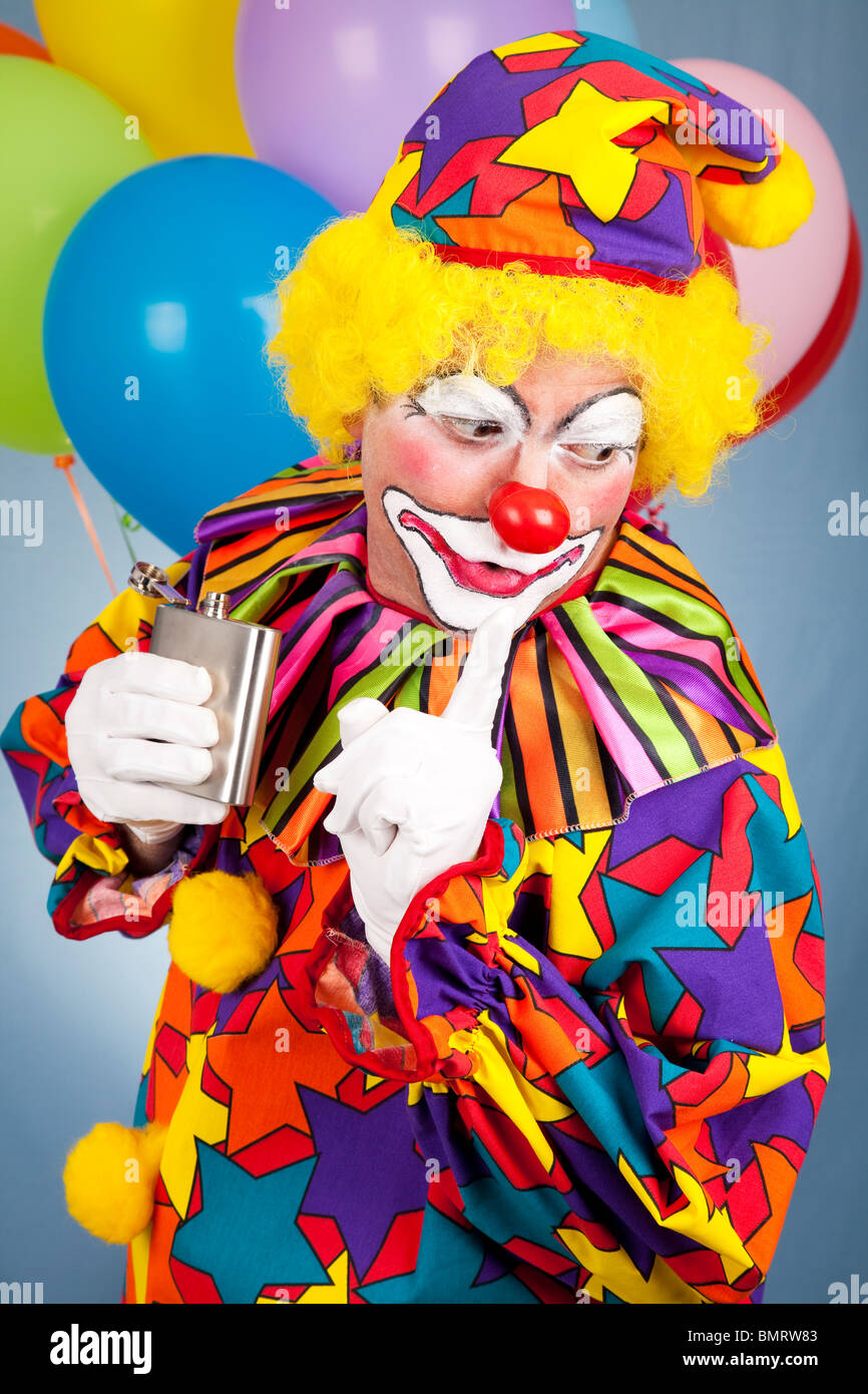 Alcoholic clown gets caught sneaking a drink from his flask Stock Photo ...