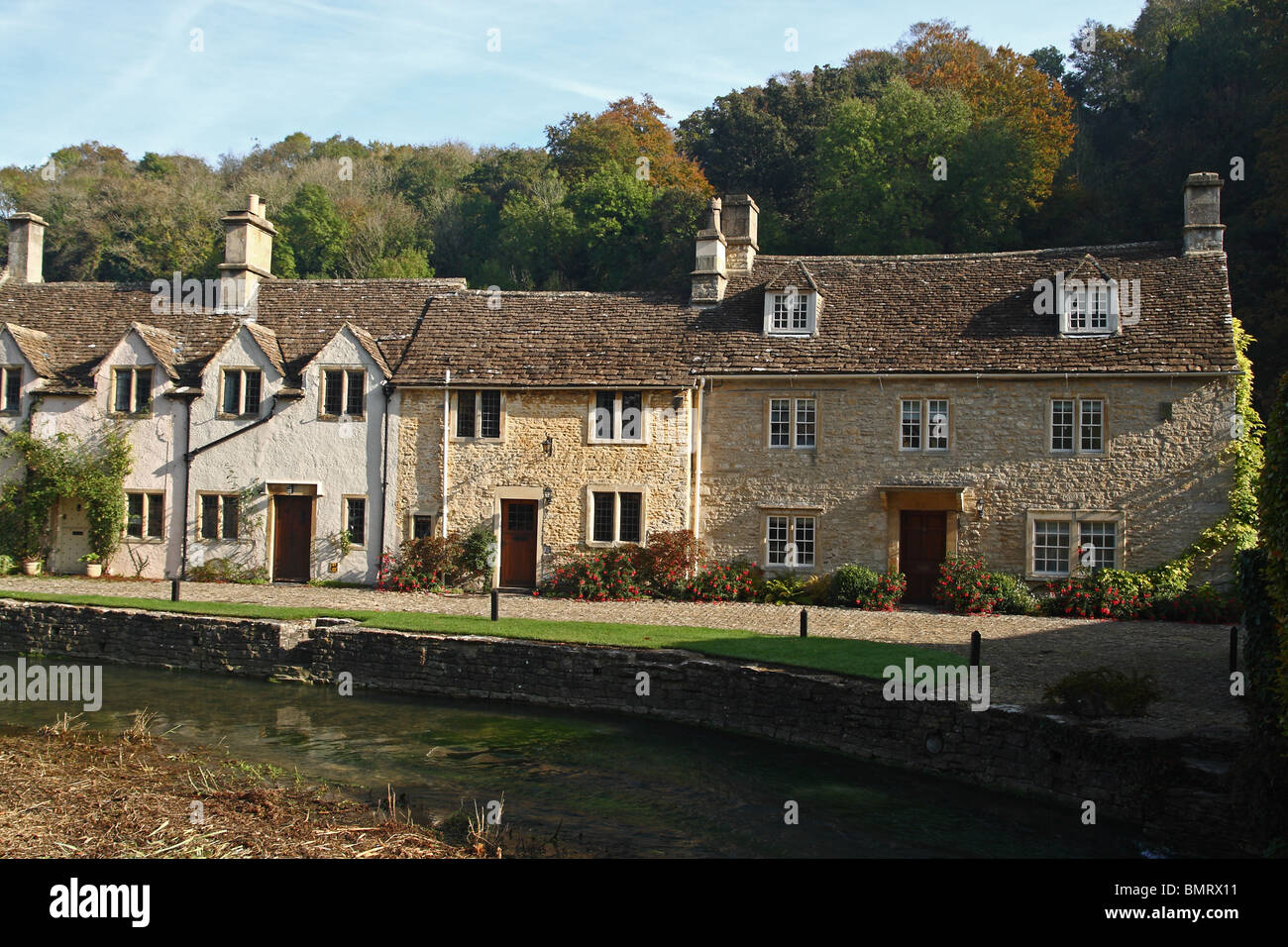 Castle Combe, Wiltshire, England. Cottages along the Bybrook river ...