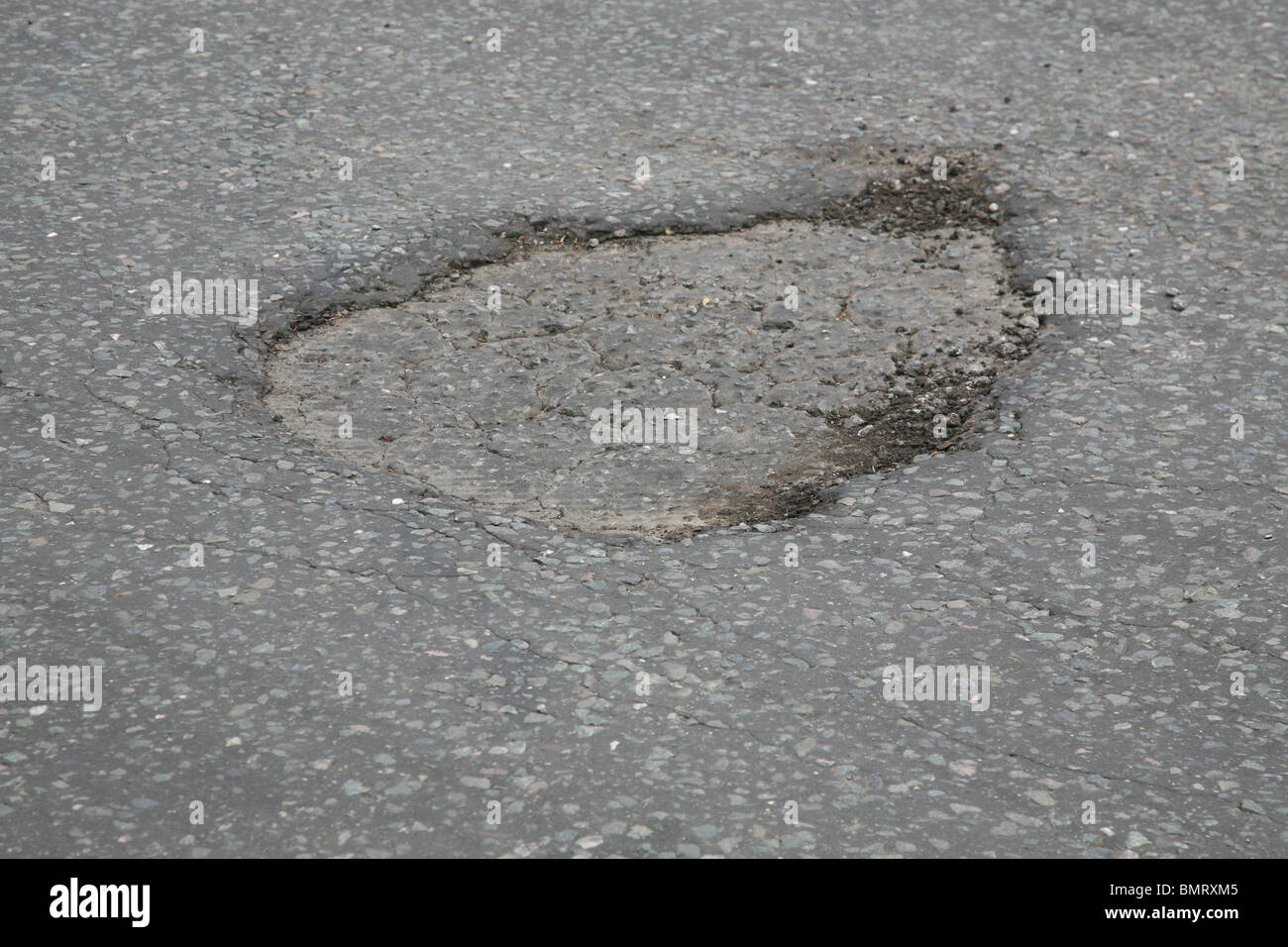pothole damage on a road Stock Photo - Alamy