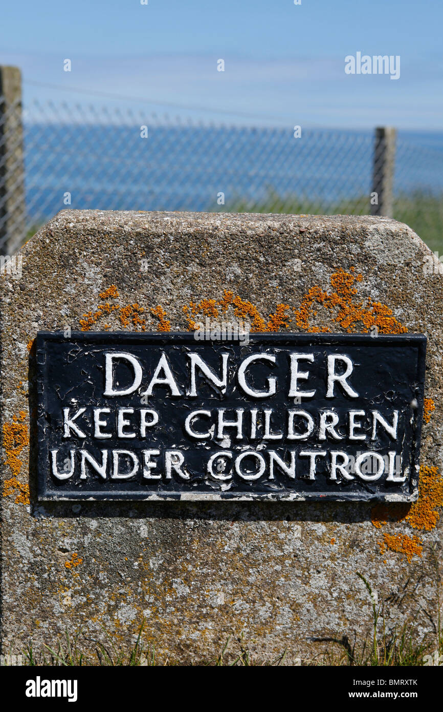A sign states "Danger Keep Children Under Control Stock Photo - Alamy