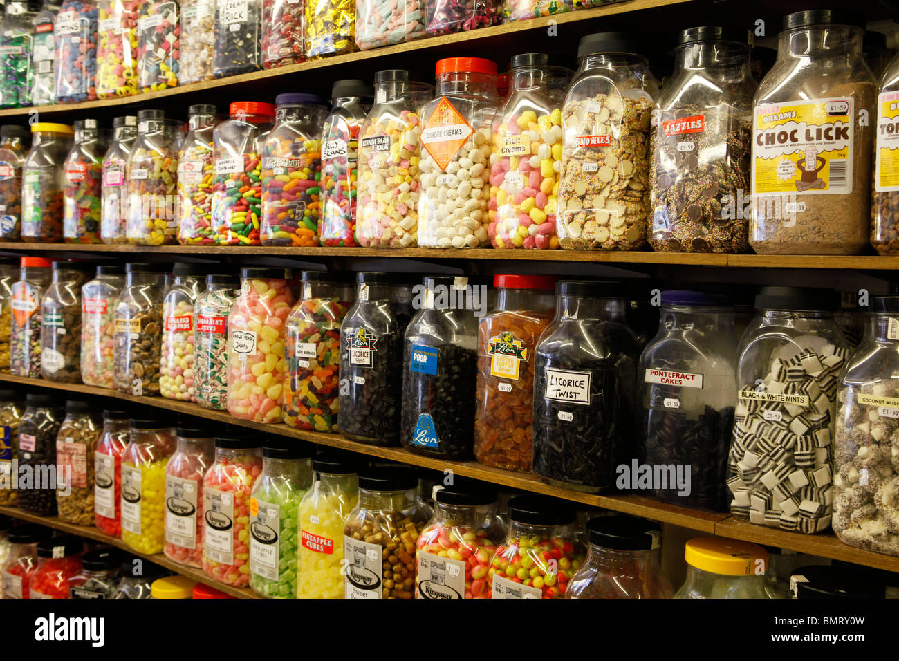 Jars of loose sweets stand on the shelves of a sweet shop Stock Photo ...