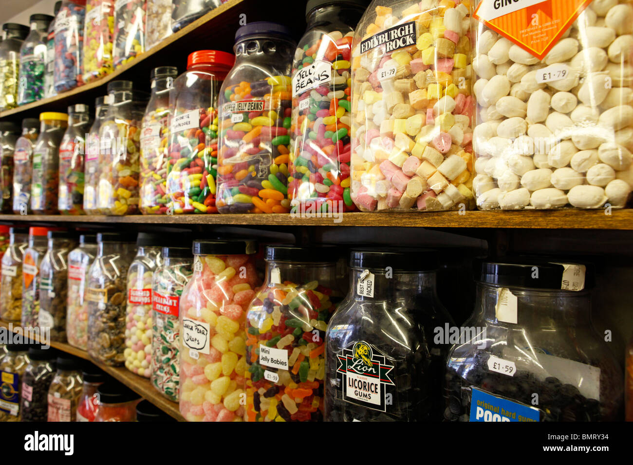 Jars of loose sweets stand on the shelves of a sweet shop Stock Photo ...