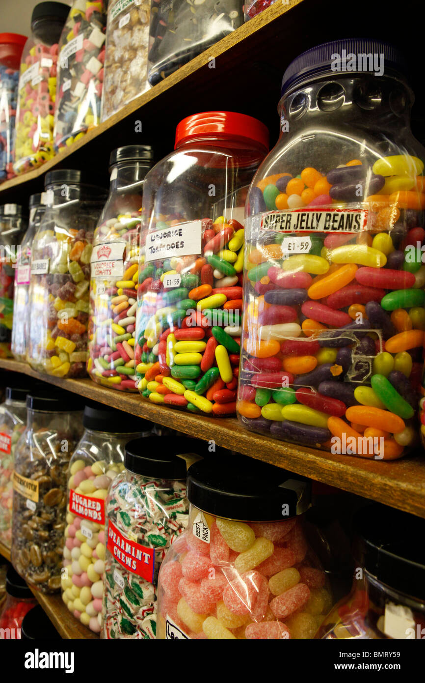 Jars of loose sweets stand on the shelves of a sweet shop Stock Photo ...