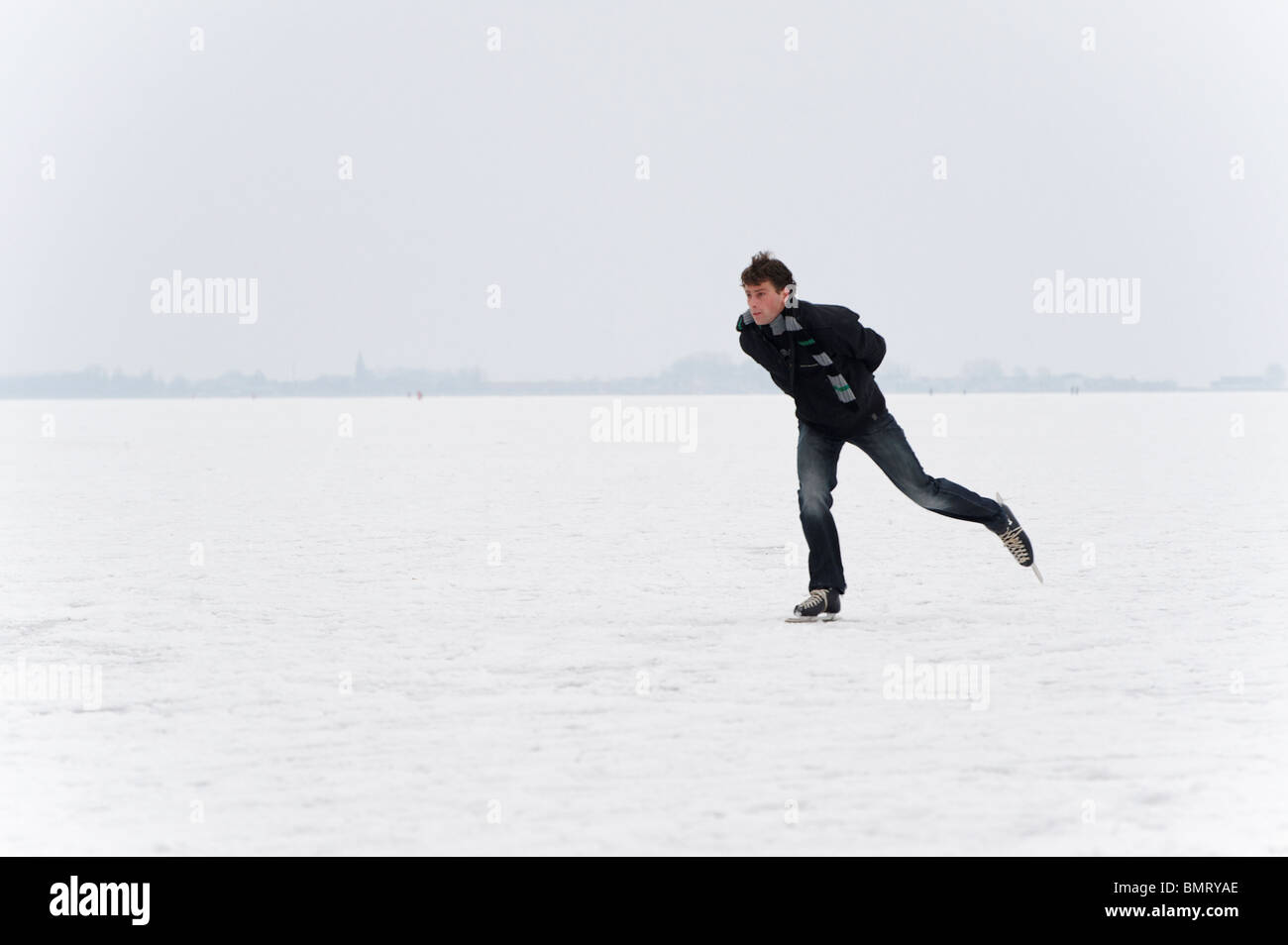 Dutch Winter, Ice Skating and Ice Wind Surfing an a frozen lake in ...