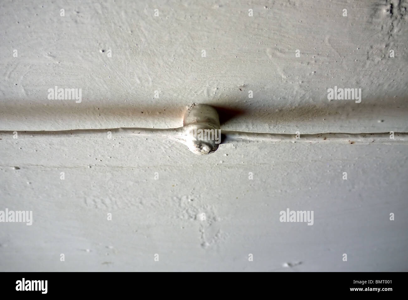 Fragment of external electric wiring in old wooden country house in ...