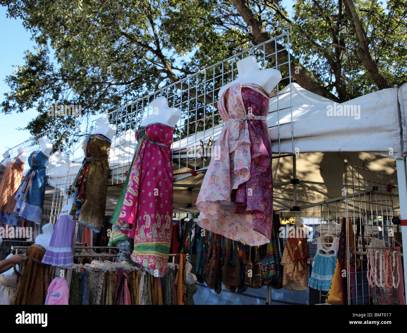 outdoor dress shop stall with hanging dresses women's colorful with ...