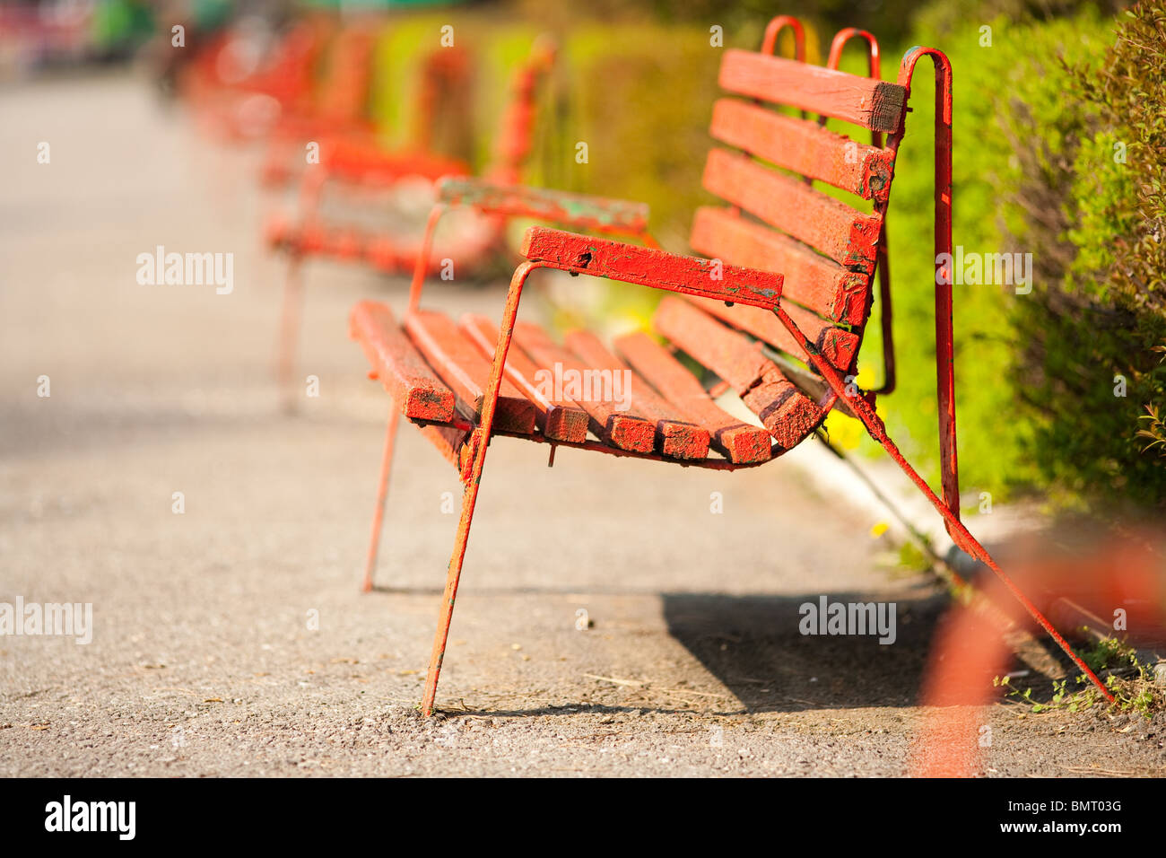 Row of red benches hi-res stock photography and images - Alamy