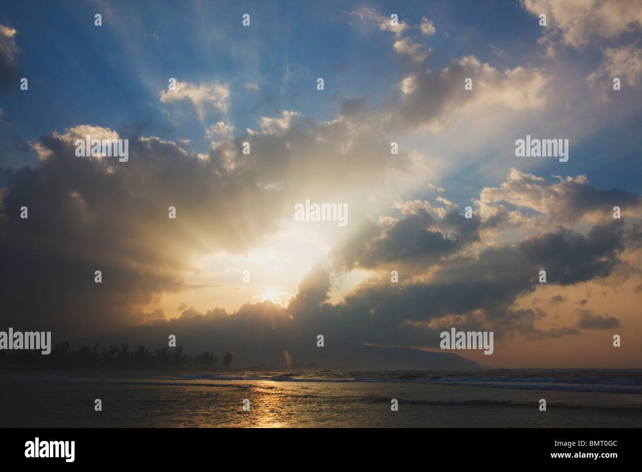 Sunburst Through The Clouds Over The Ocean Stock Photo - Alamy