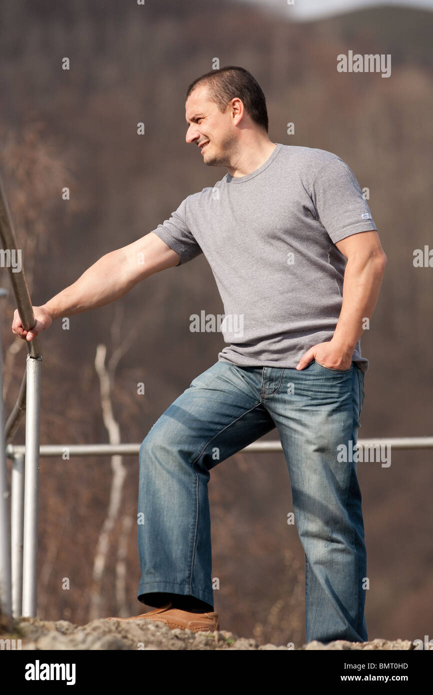 Full length portrait of a young caucasian man outdoors Stock Photo - Alamy